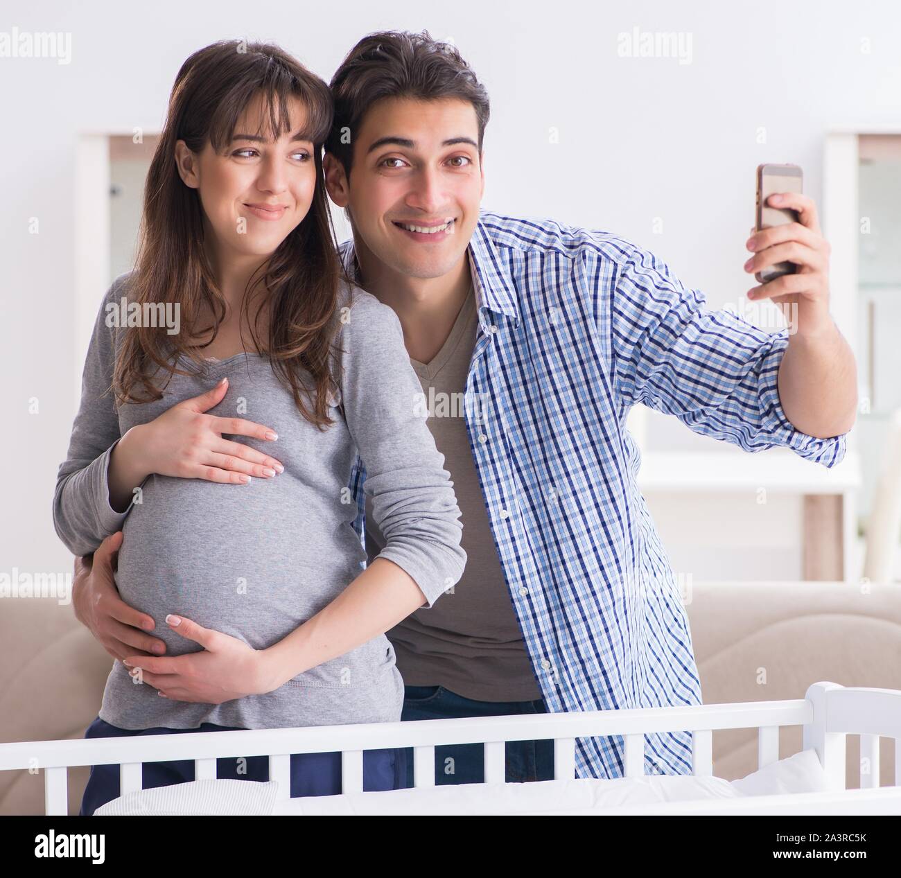 The young parents expecting their first baby Stock Photo - Alamy