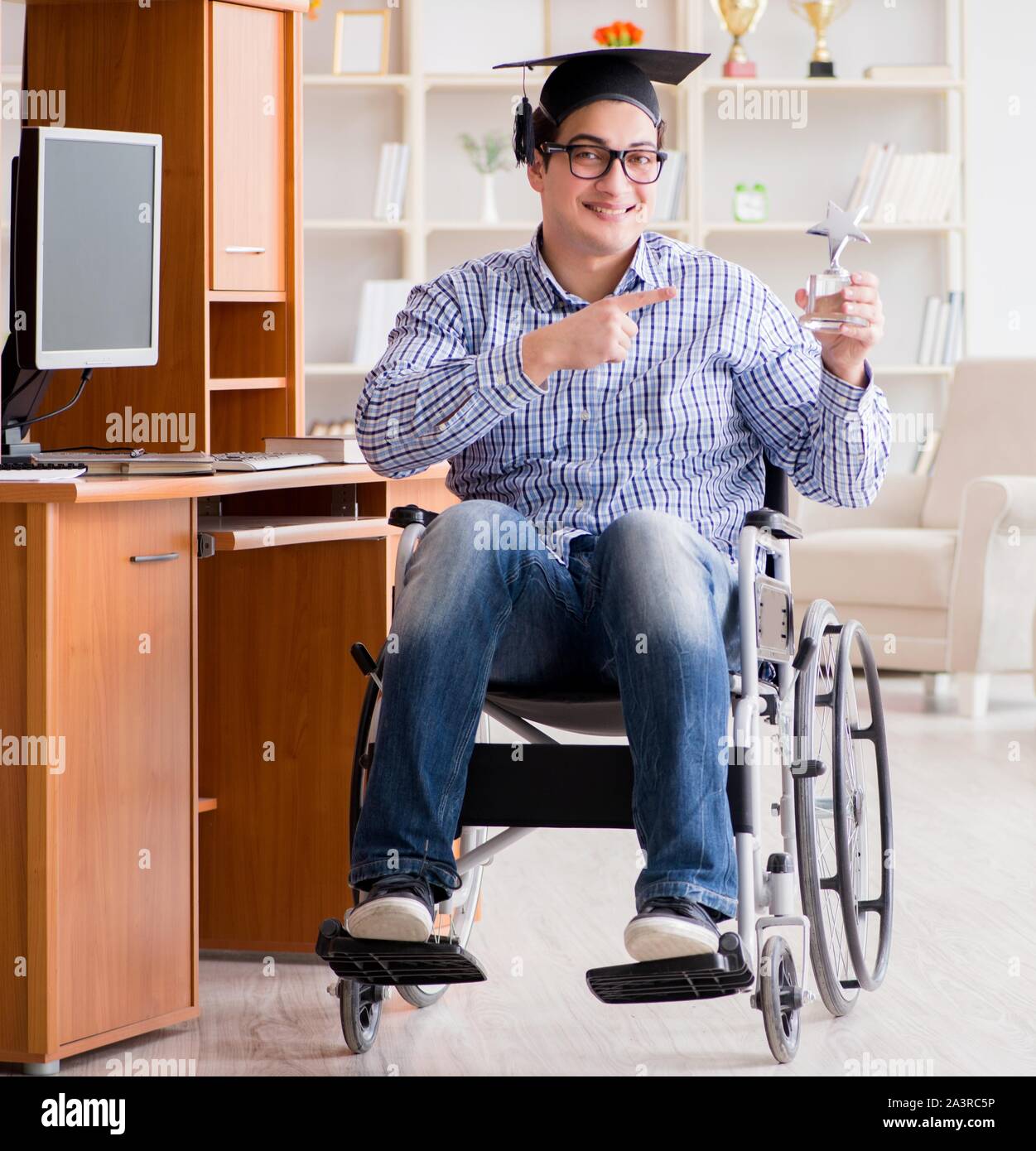 The disabled student studying at home on wheelchair Stock Photo - Alamy