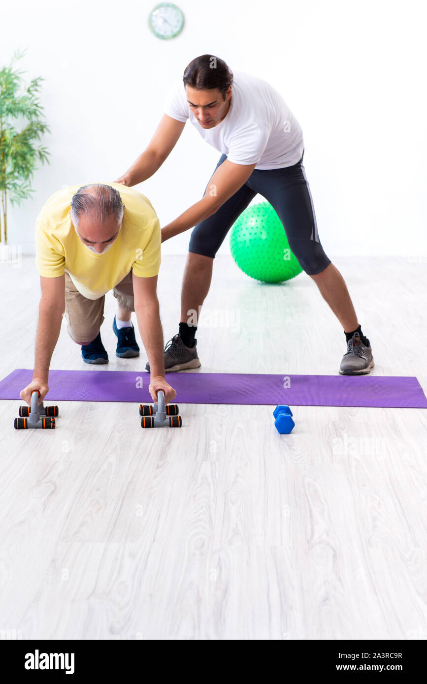 The old man doing exercises indoors Stock Photo - Alamy