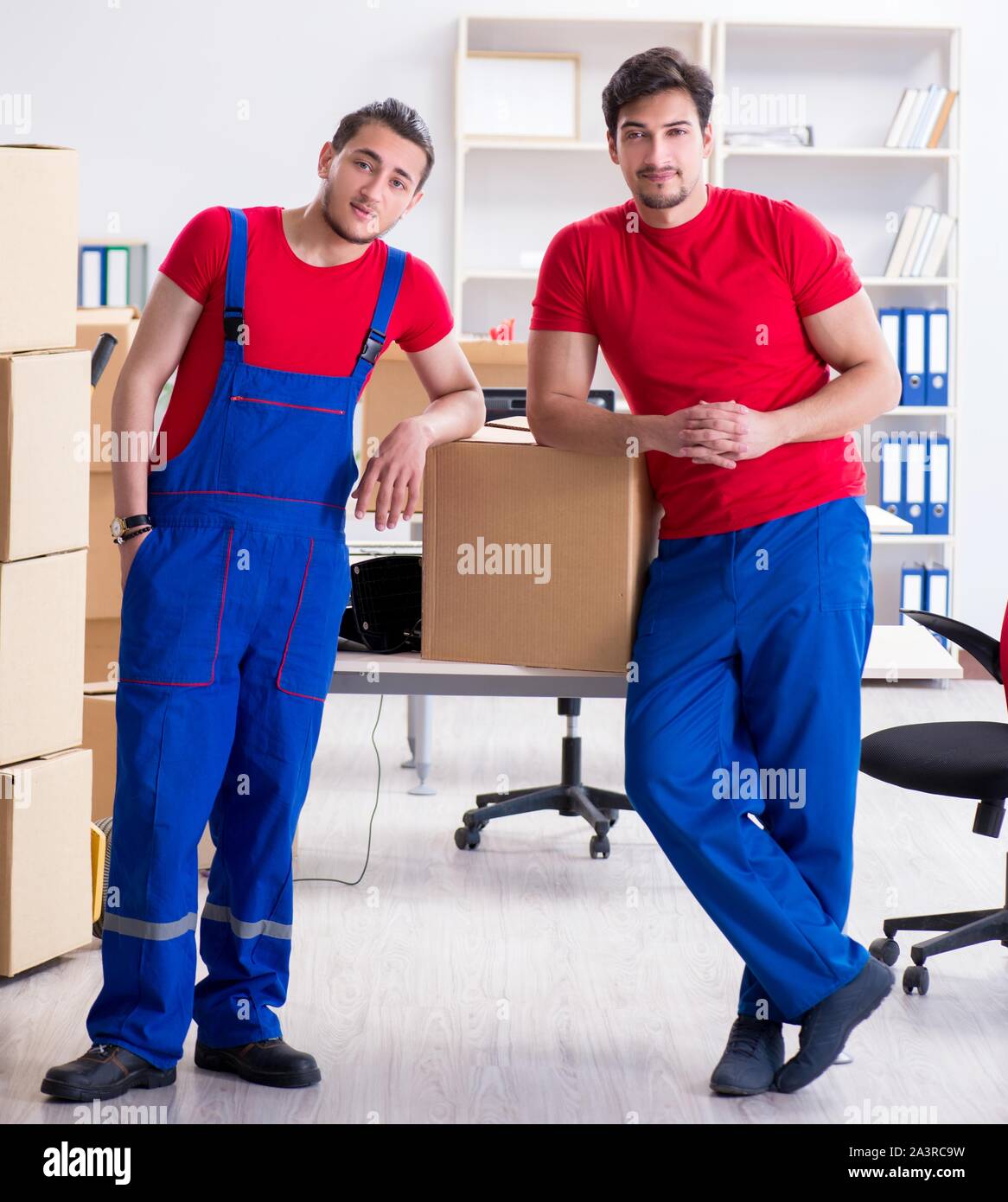 The two contractor employees moving personal belongings Stock Photo - Alamy