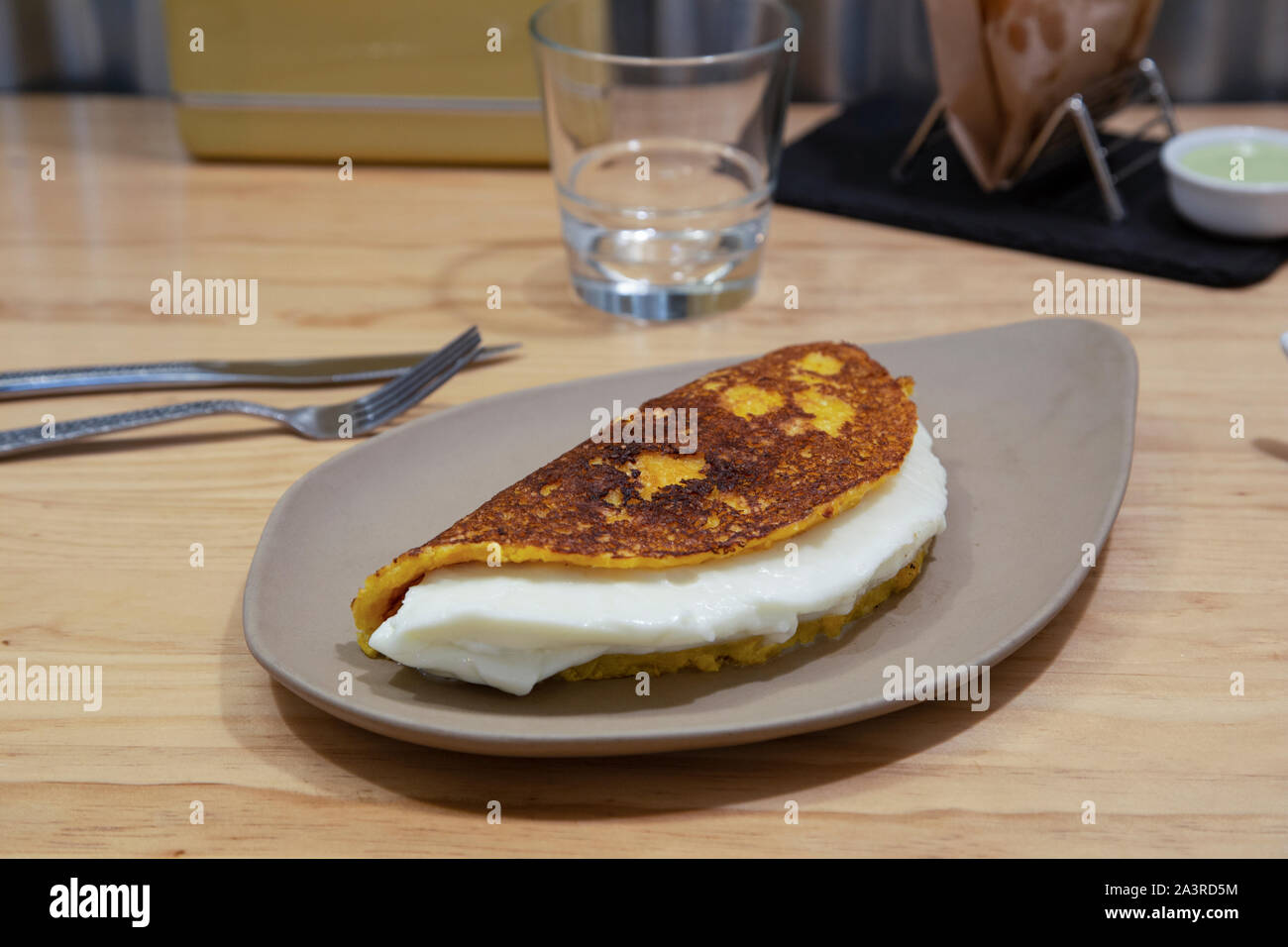 Cachapa with cheese, typical Venezuelan dish made with corn, cheese and ...