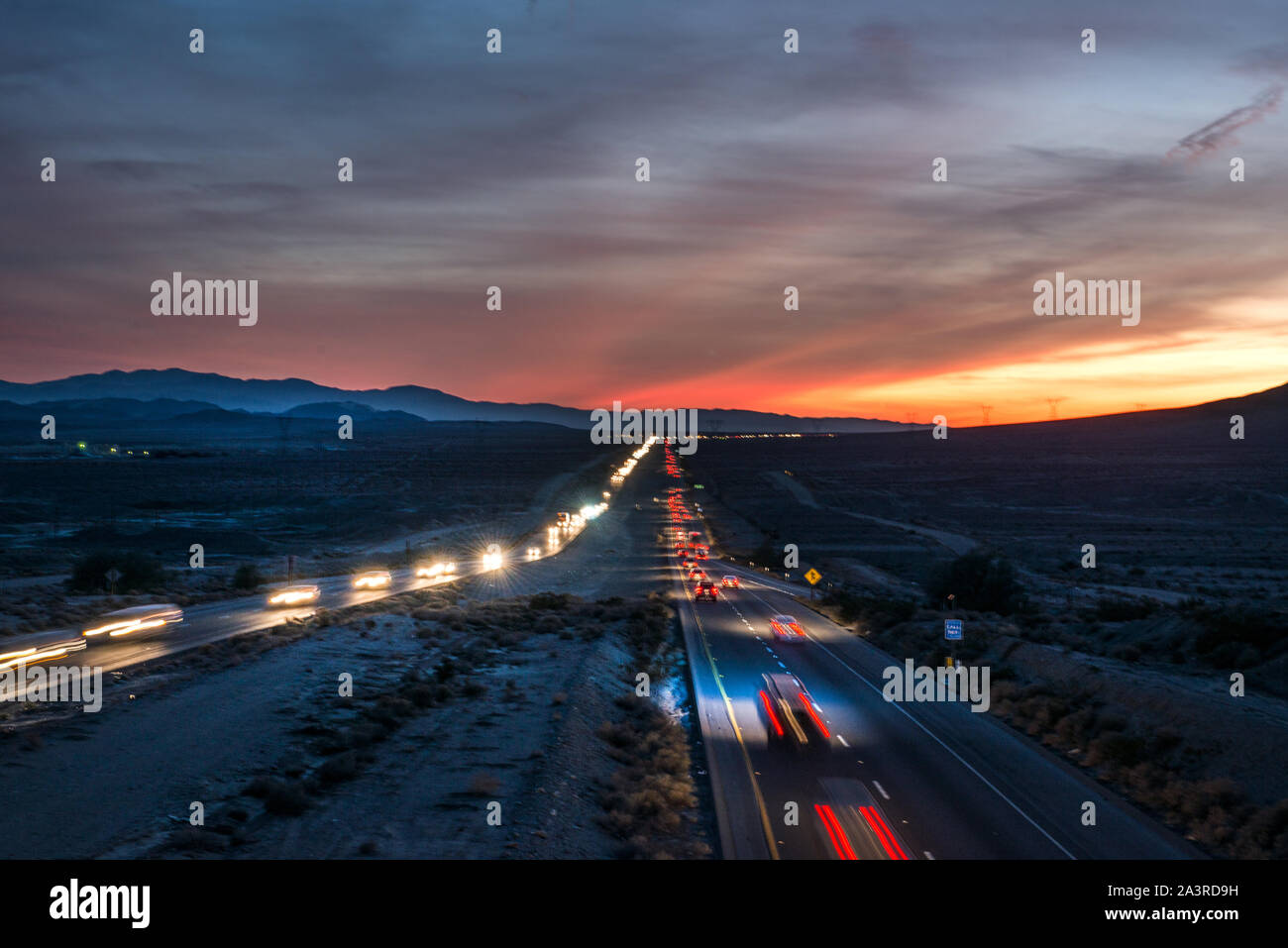 Sunset over the Soda Mountains and the Barstow Freeway (Interstate Highway 15) east of Baker ...