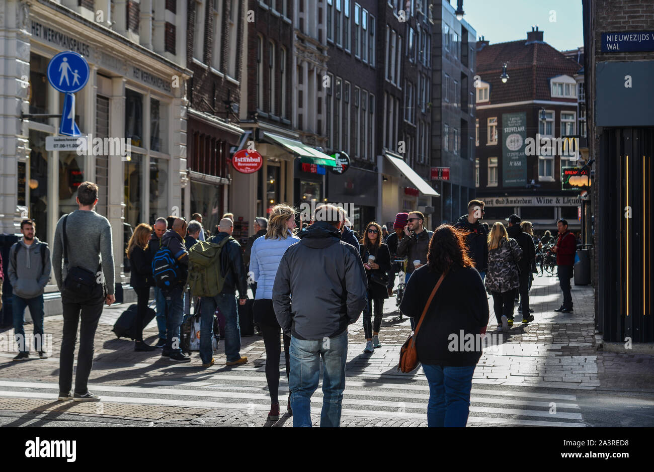 Amsterdam, Holland - Oct 7, 2018. People walk on street in Amsterdam ...
