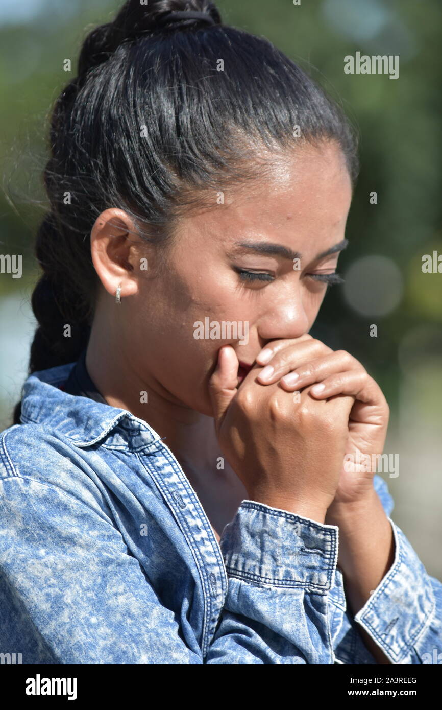 Pretty young woman praying in hi-res stock photography and images - Alamy