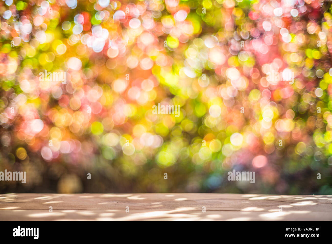 Autumn background with a wooden table and beautiful sunny bokeh Stock ...