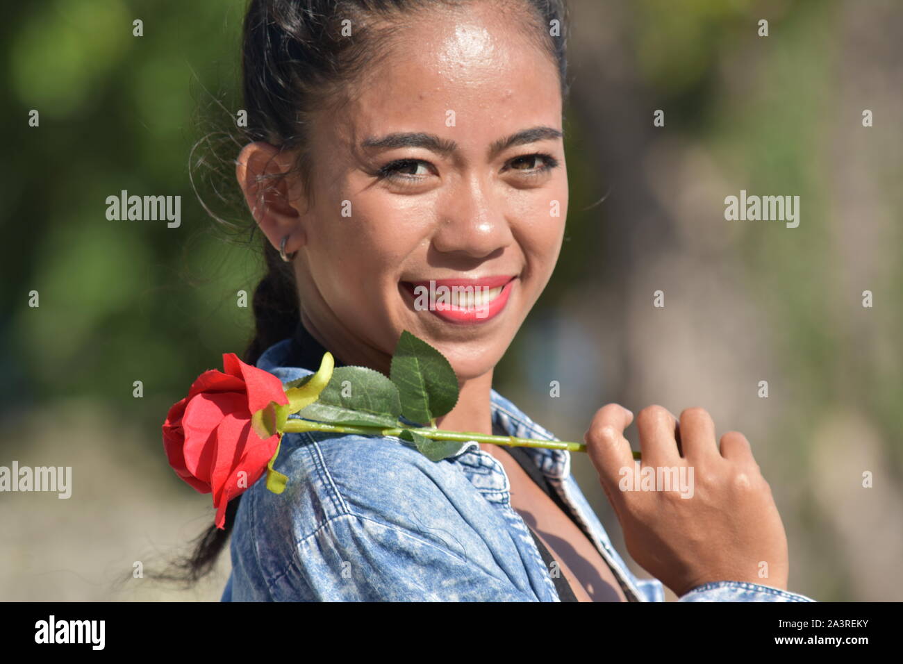 Happy Asian Female With Rose Flower Stock Photo - Alamy