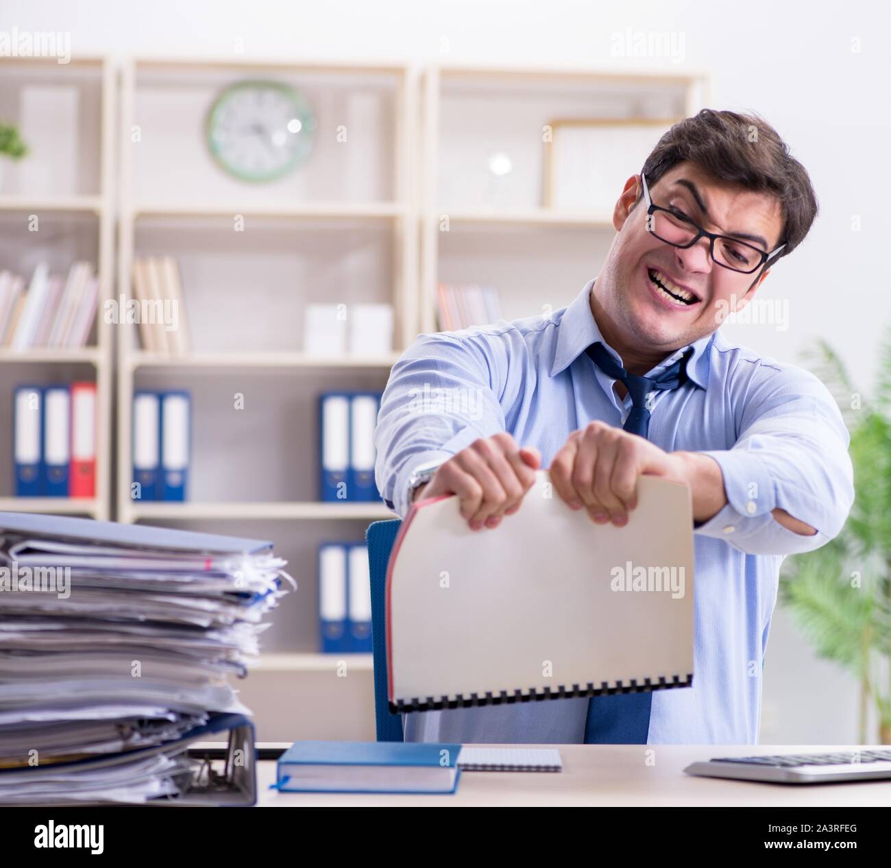 The tired businessman with too much paperwork Stock Photo - Alamy
