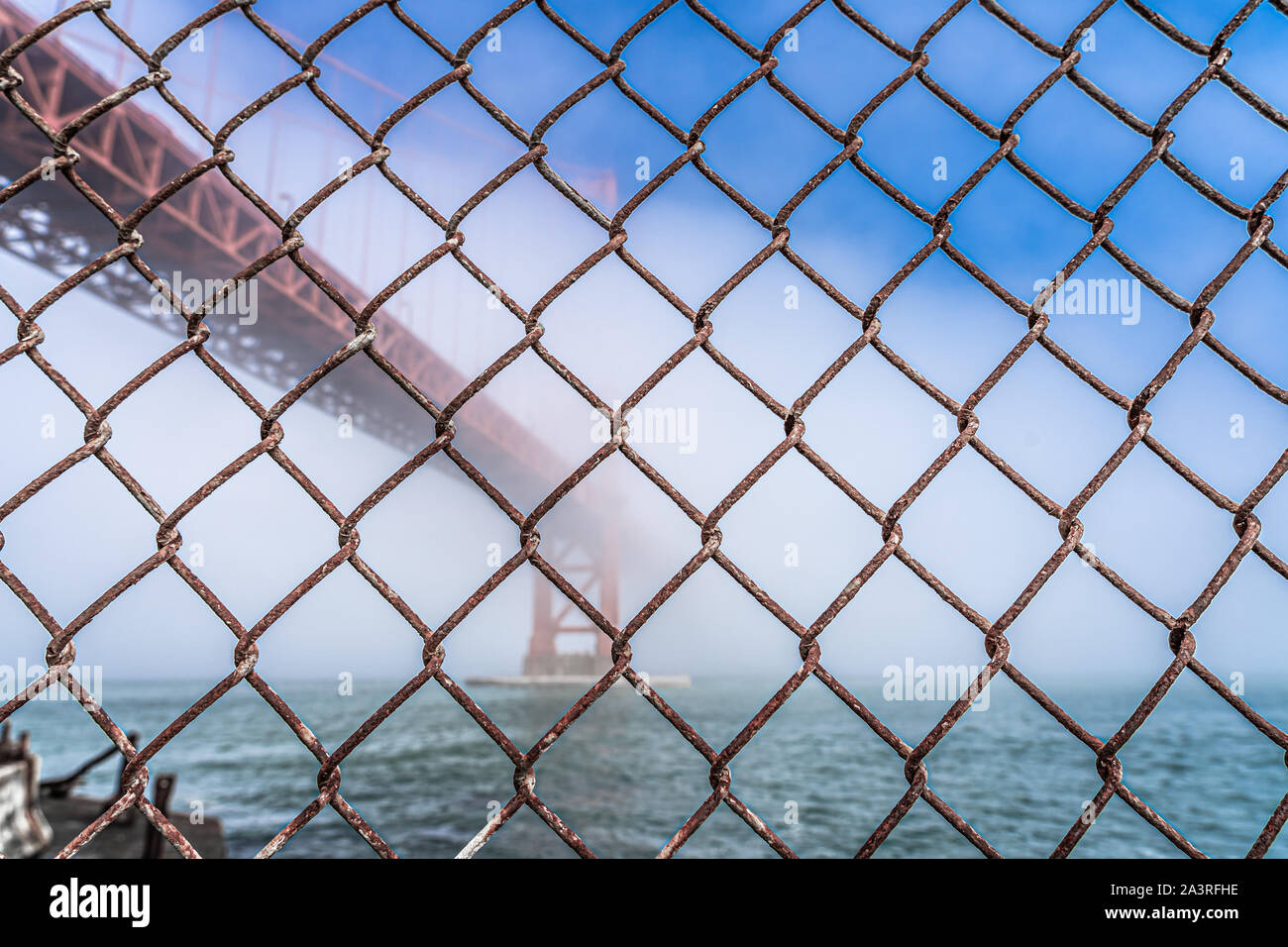 Dramatic Golden Gate Bridge through fence Stock Photo - Alamy
