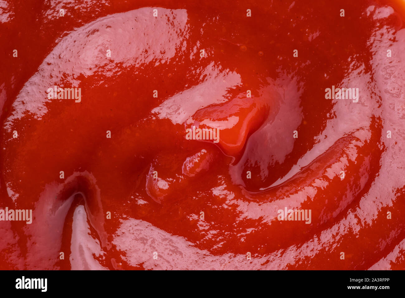 Red tasty tomato ketchup puddle close-up Stock Photo - Alamy