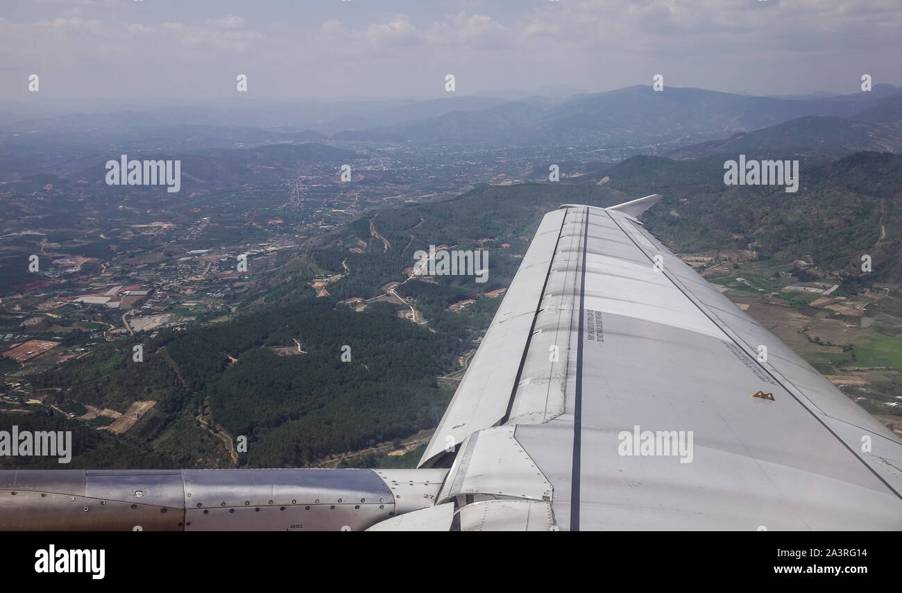 Flying with an airplane, view of the wings, engine, sky and the clouds ...
