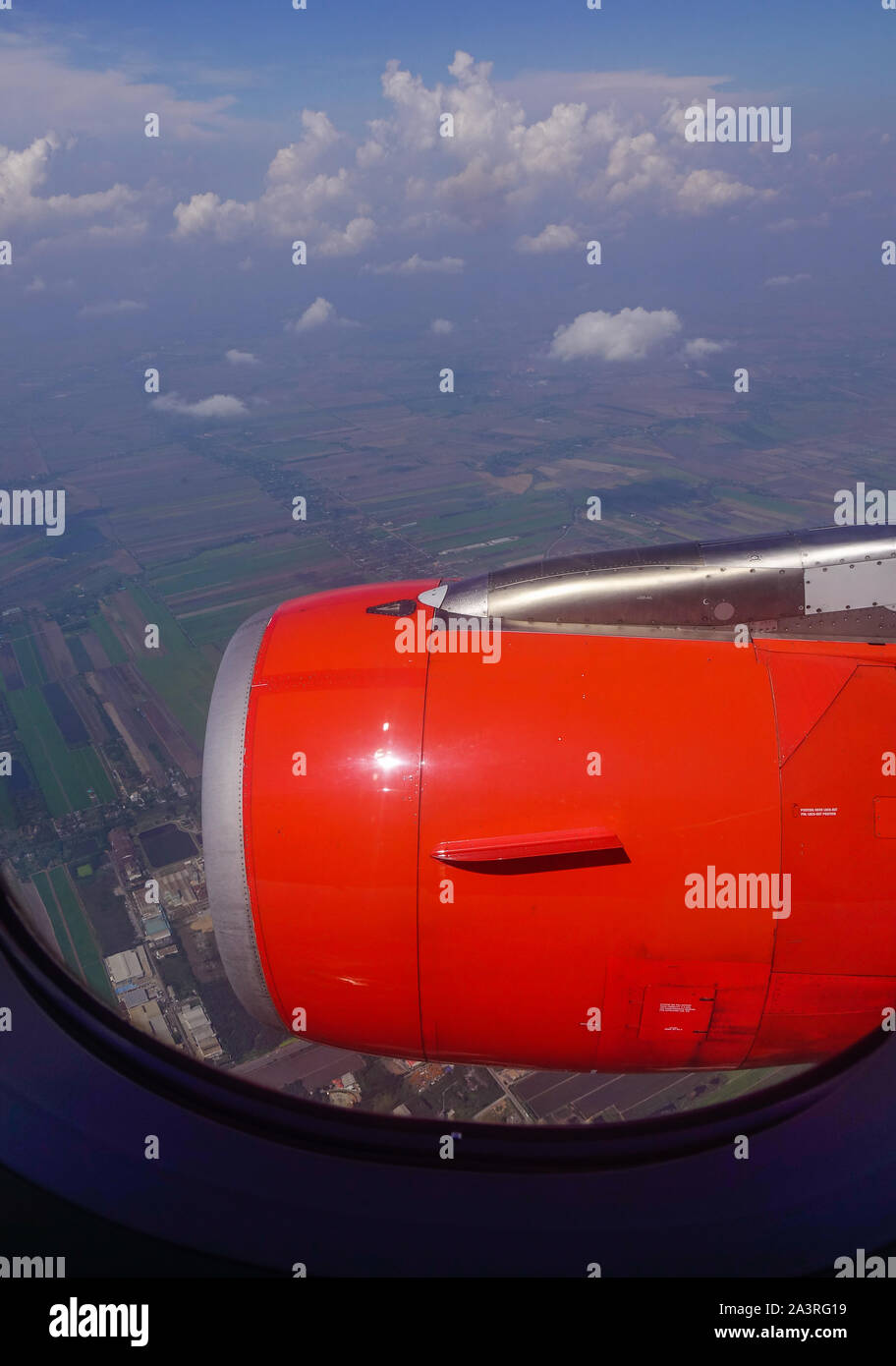 Flying with an airplane, view of the wings, engine, sky and the clouds ...