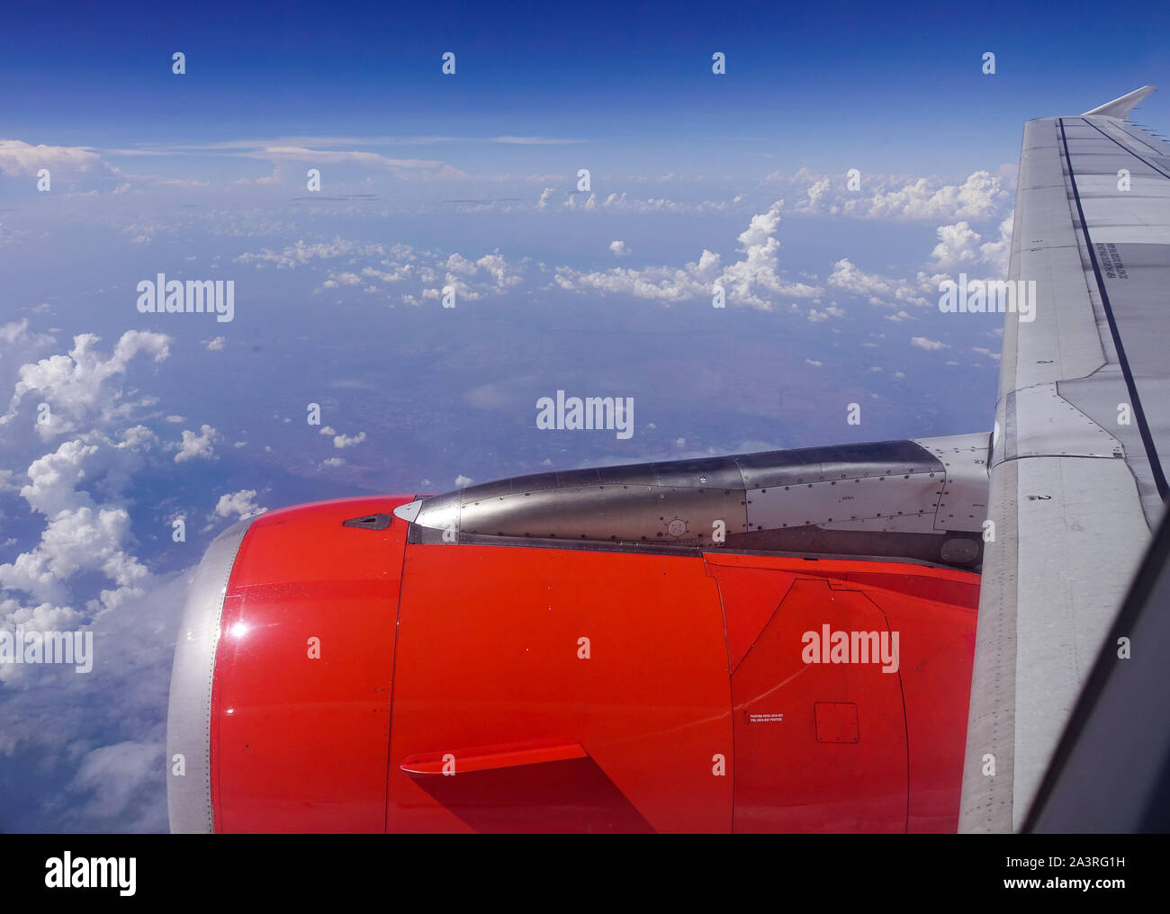 Flying with an airplane, view of the wings, engine, sky and the clouds ...