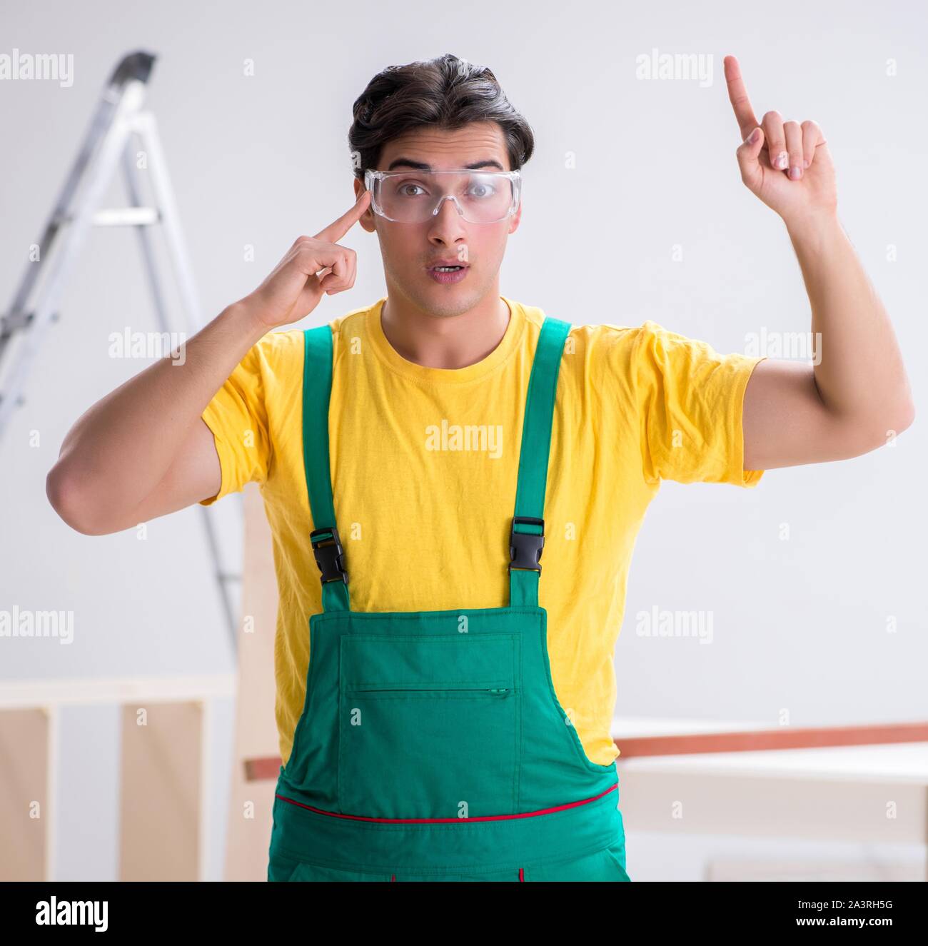 Worker wearing protective goggles at construction site Stock Photo - Alamy