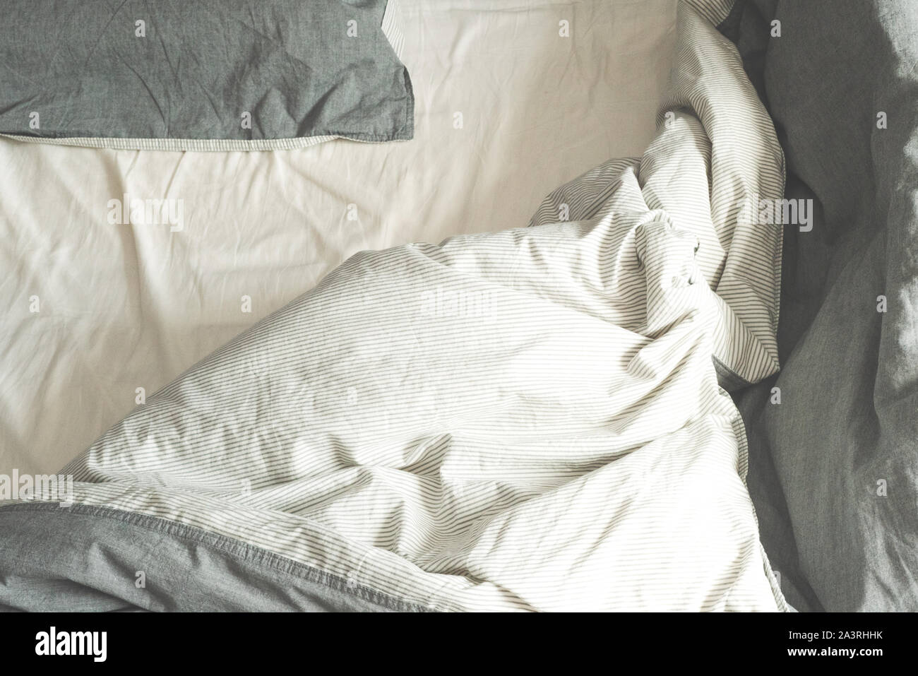 Crumpled gray fabric. Bed in the morning. The spread out bed. Linens ...