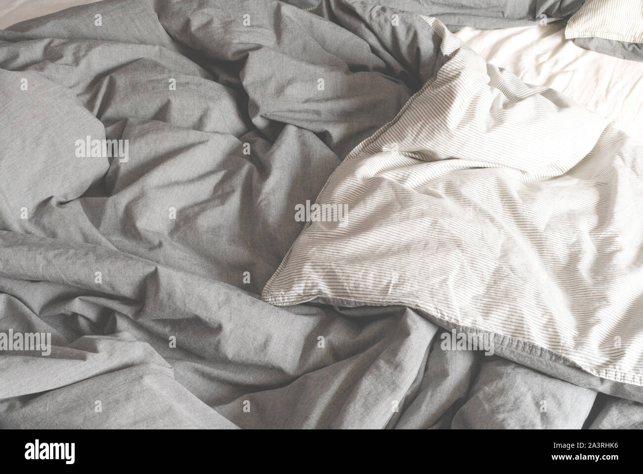 Crumpled gray fabric. Bed in the morning. The spread out bed. Linens ...