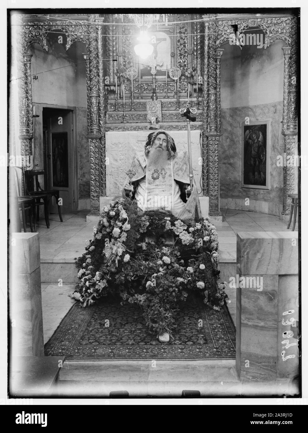 Syrian bishop's remains (funeral). Corpse seated in church Stock Photo ...