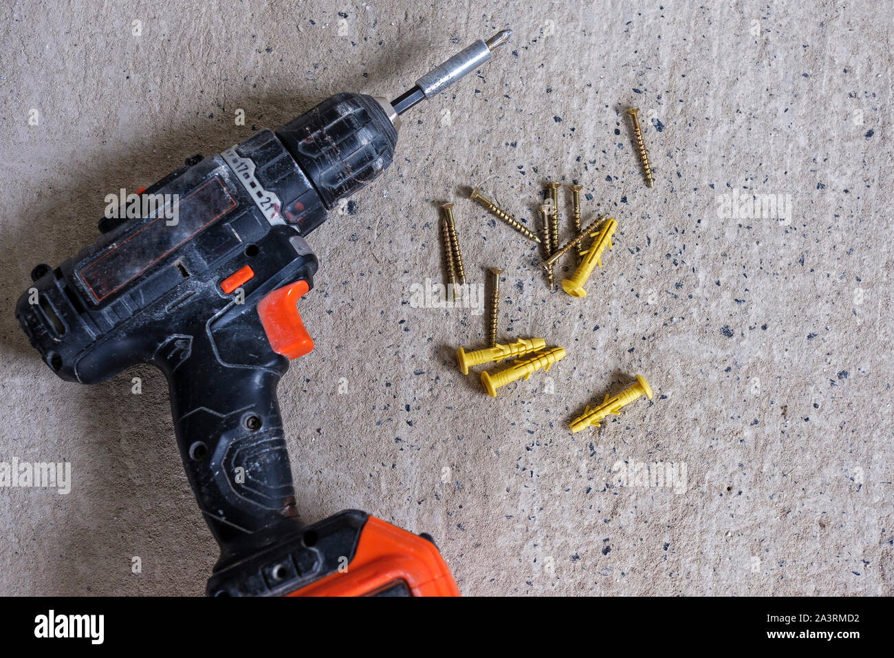 Professional automatic screwdriver and some yellow dowel nails for ...