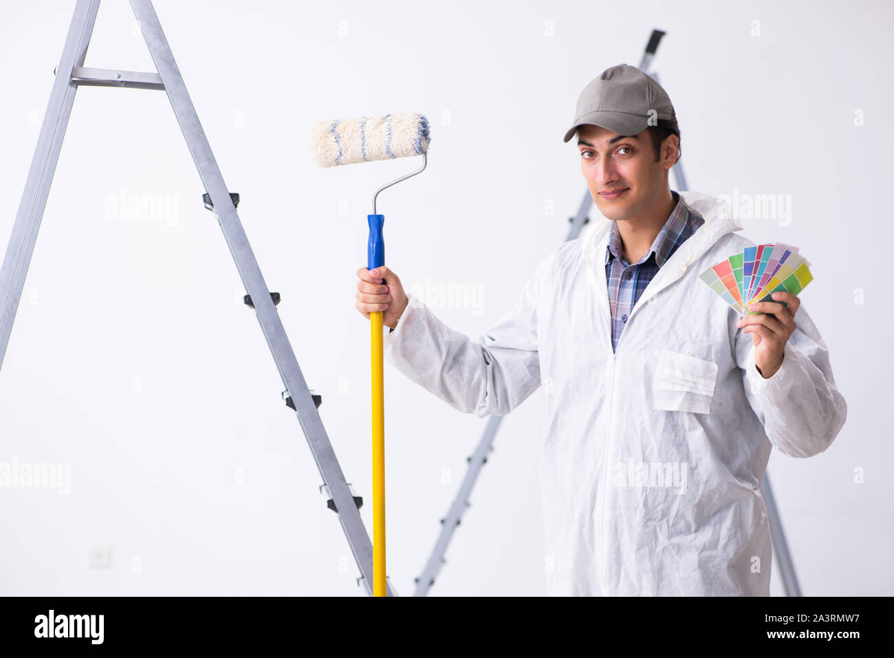 Painter working at the construction site Stock Photo - Alamy