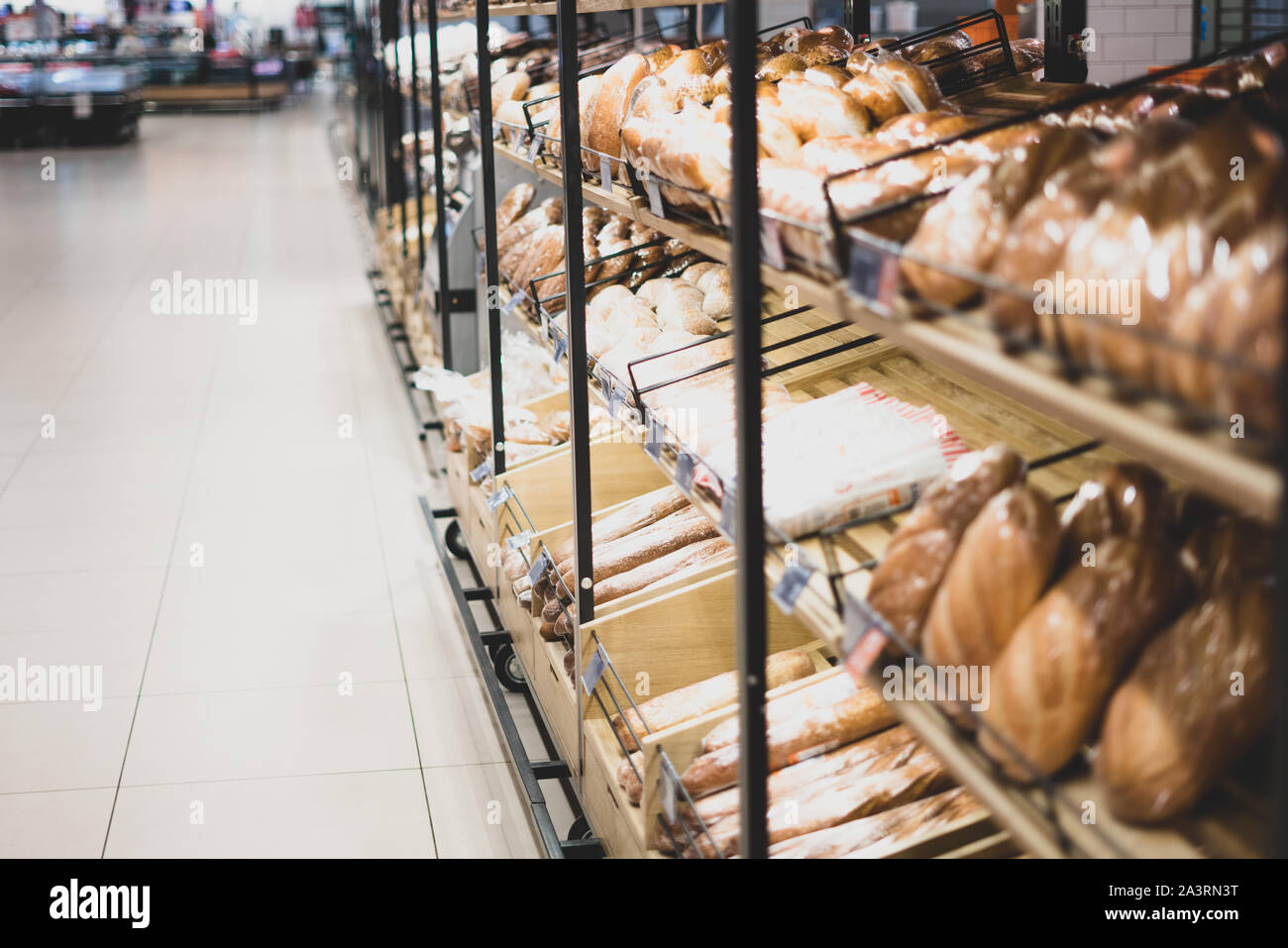 Bakery showcase. Freshly baked bread. Presentation of bread in a shop ...