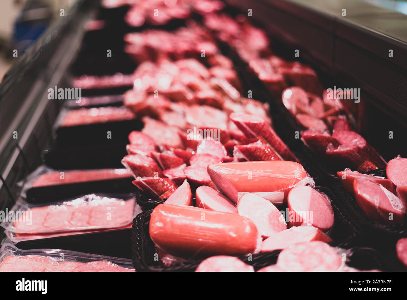 Sausage on a shop window. Presentation of sausages in the trade. Types ...