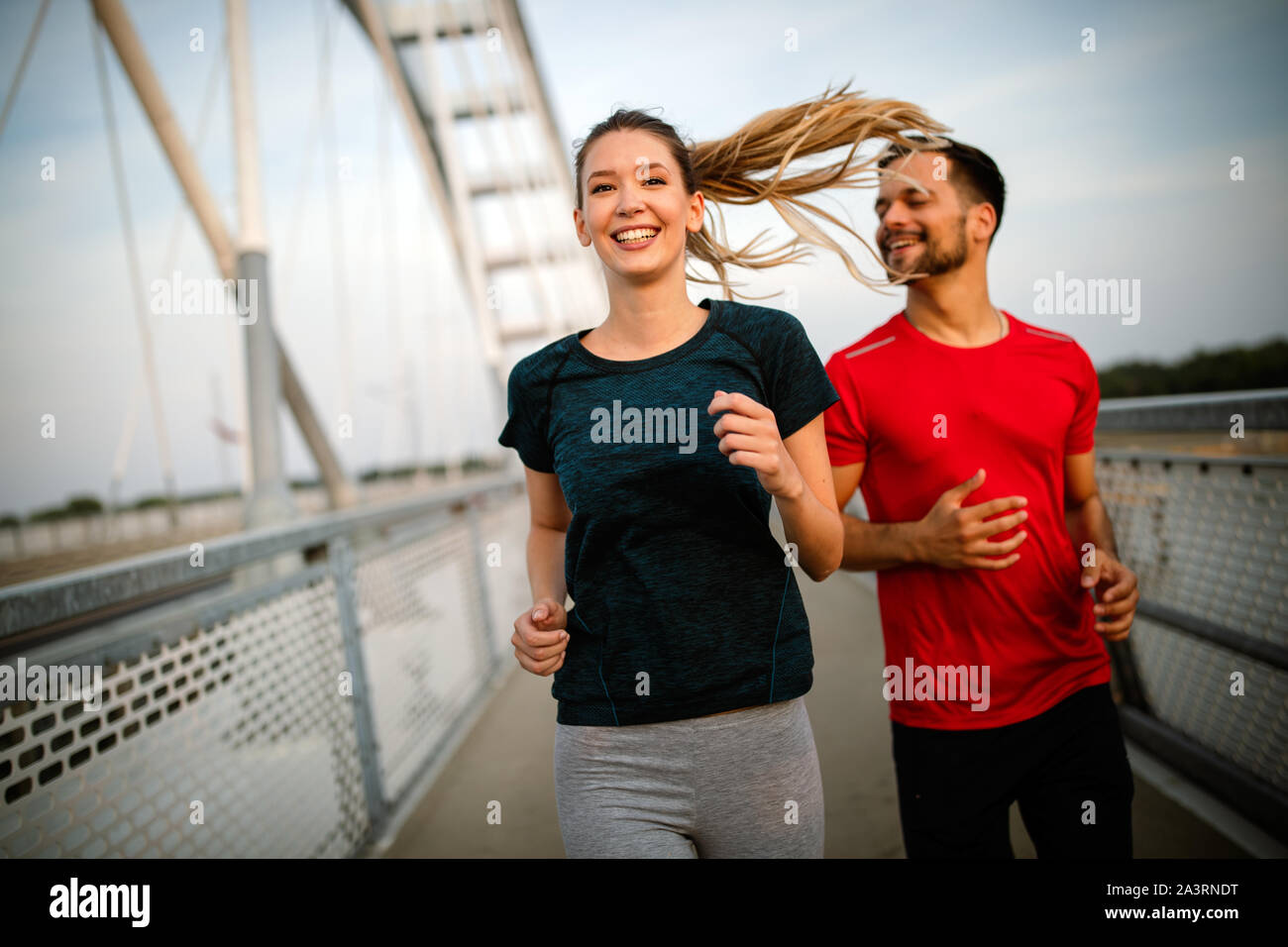 Young people running and exercising. Living healthy sporty lifestyle ...