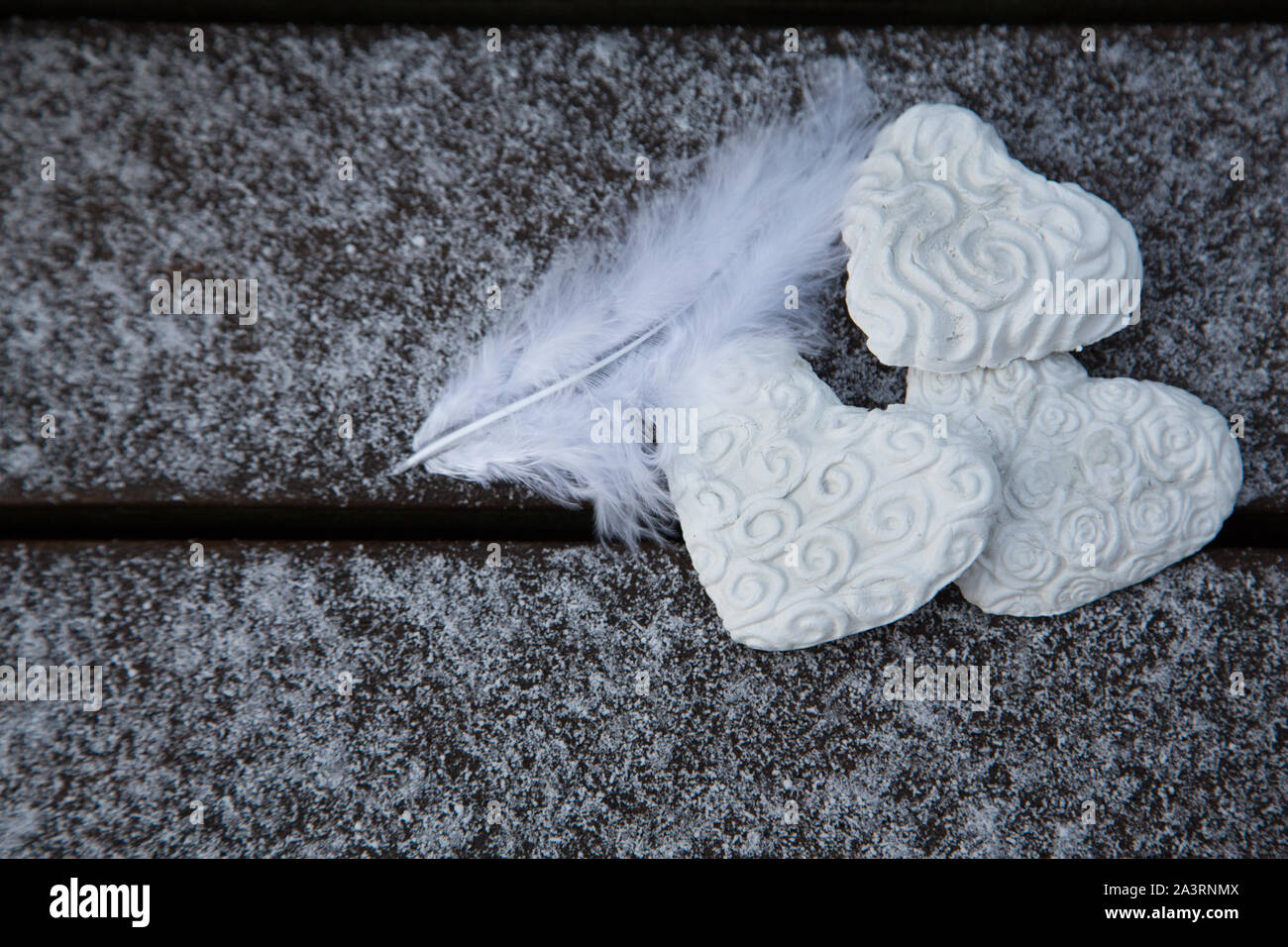 Feather and heart decoration Stock Photo - Alamy