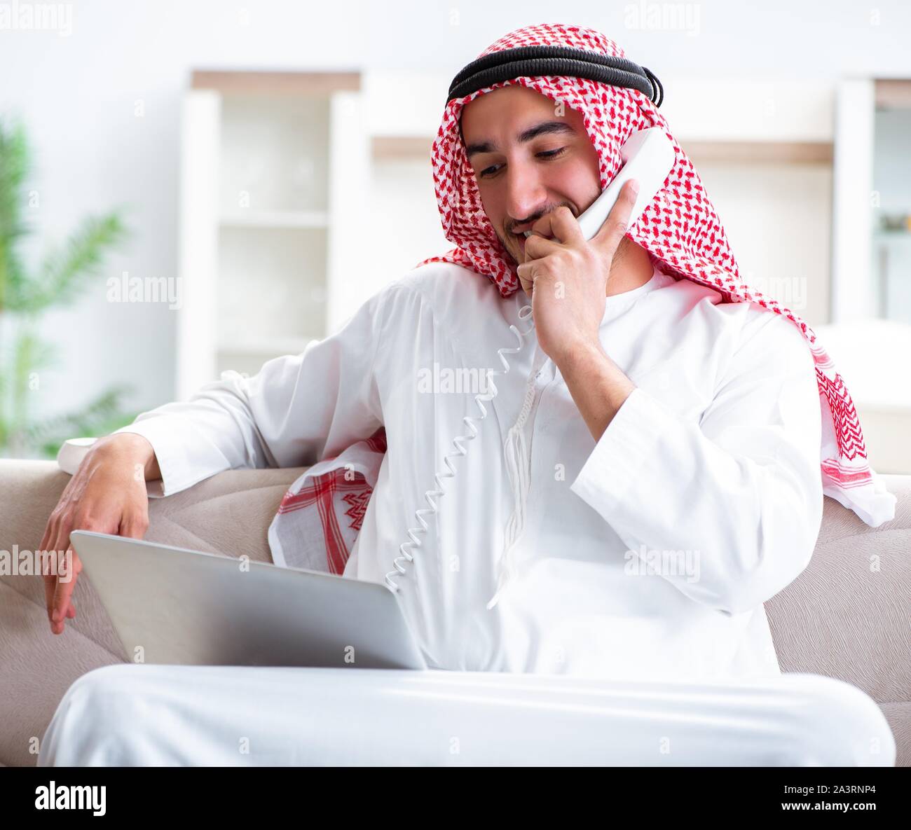 The arab man working at home on his work Stock Photo - Alamy