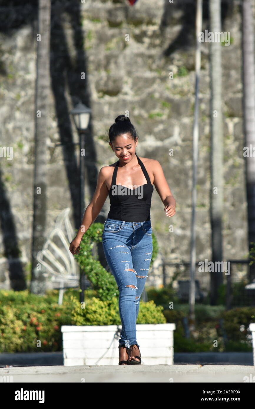 Happy Adult Female Walking Stock Photo - Alamy