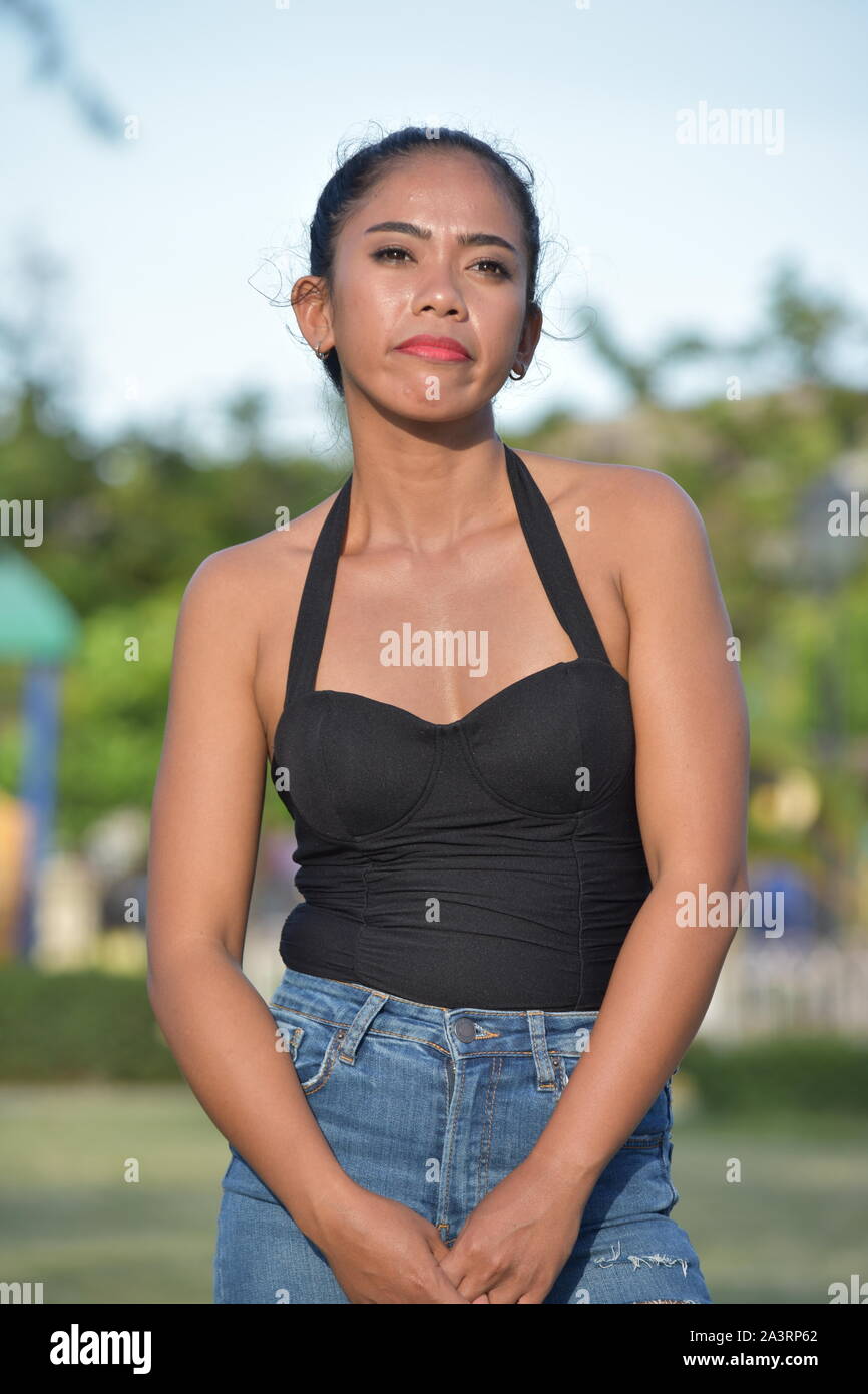 Young Filipina Woman Wondering Stock Photo - Alamy