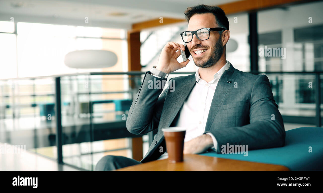 Businessman taking a break with a cup of coffee in office Stock Photo ...