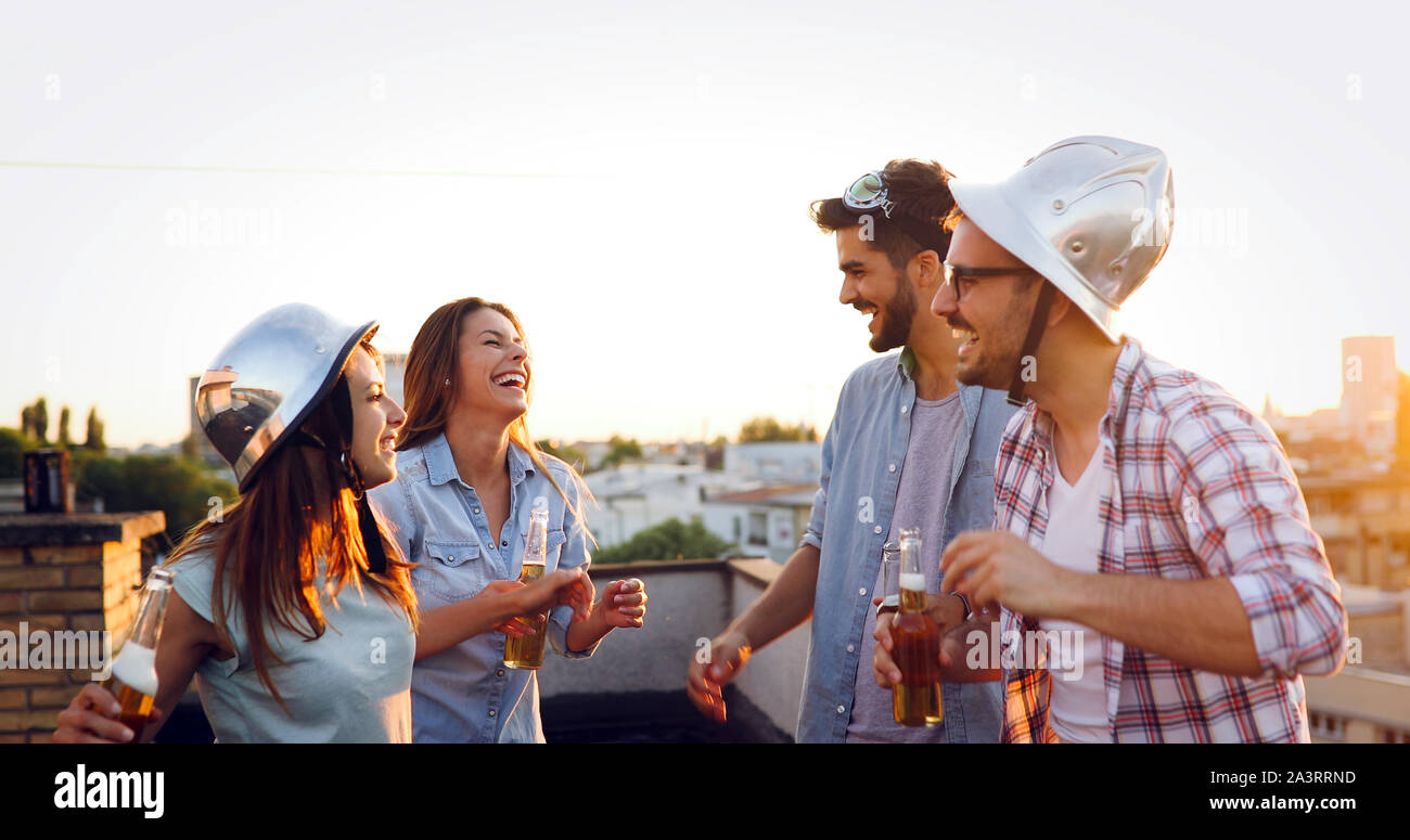 Happy cheerful friends spending fun times together Stock Photo - Alamy