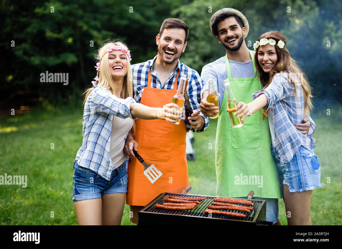 Group of friends having fun in nature doing bbq Stock Photo - Alamy