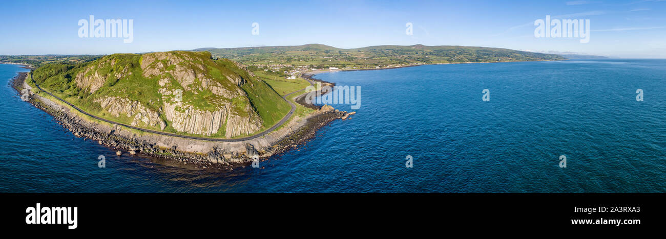Northern Ireland, UK. Wide aerial panorama of Ballygalley Head mountain ...