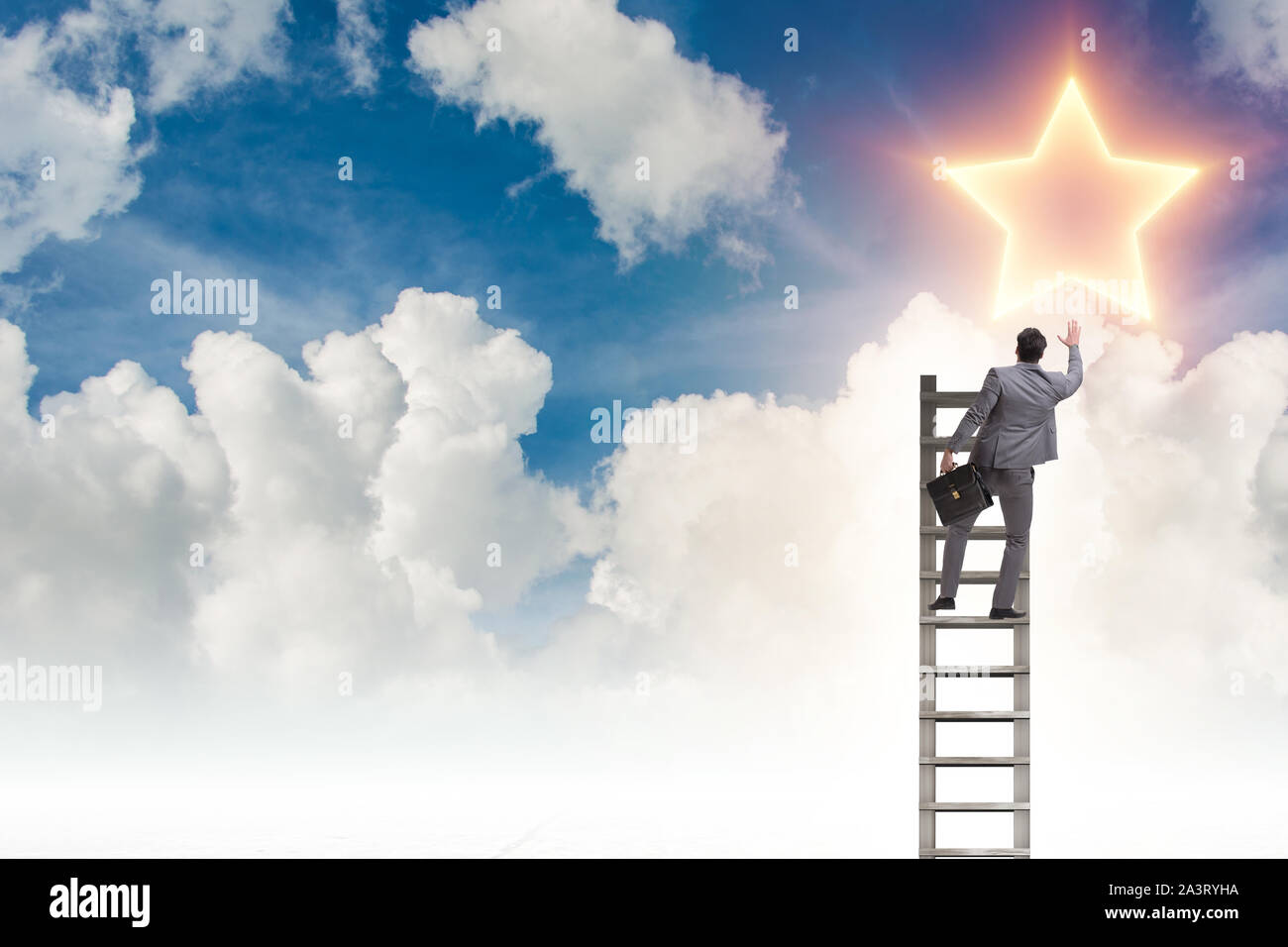 The businessman reaching out for stars Stock Photo - Alamy