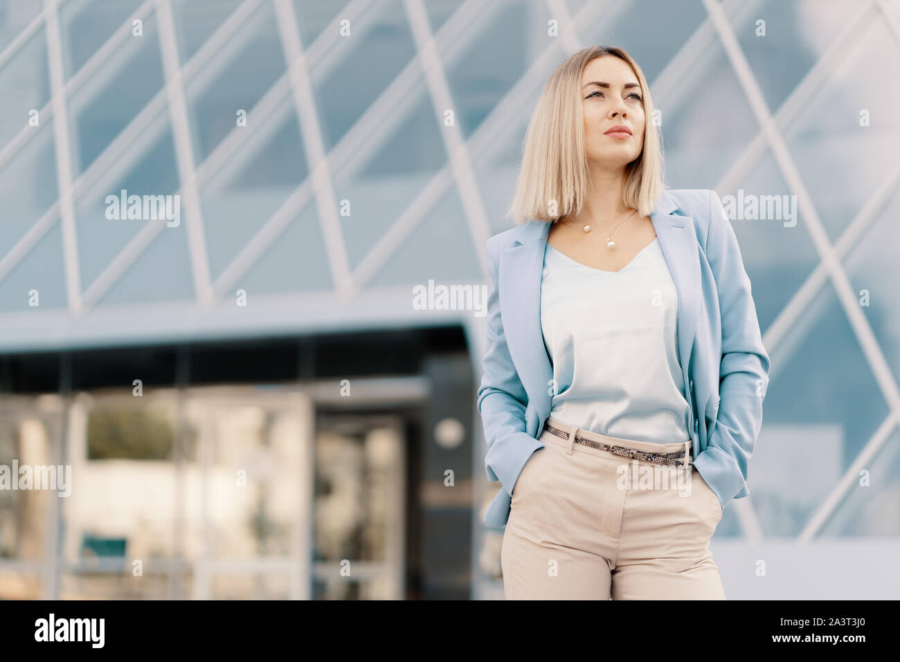 Successful business woman in blue suit. Beautiful young female ...