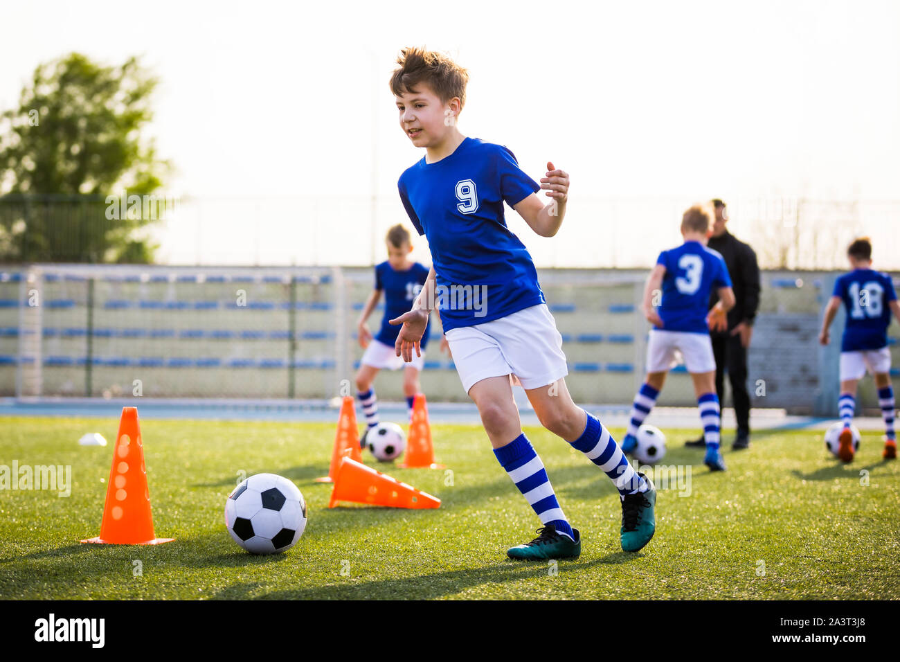 Kids Sports: Teaching Children to Improve Soccer Skills. Football camp ...