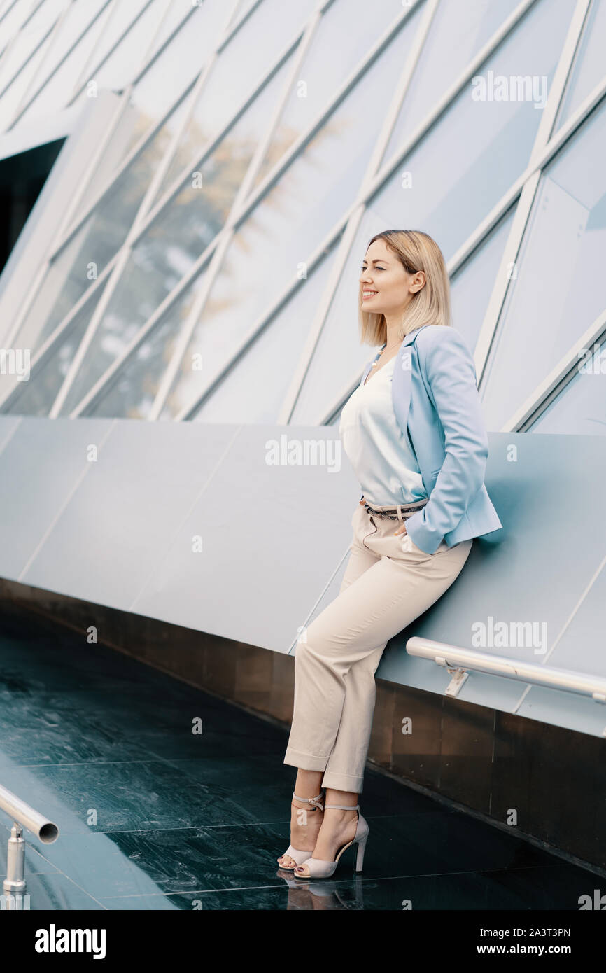 Successful business woman in blue suit. Beautiful young female ...