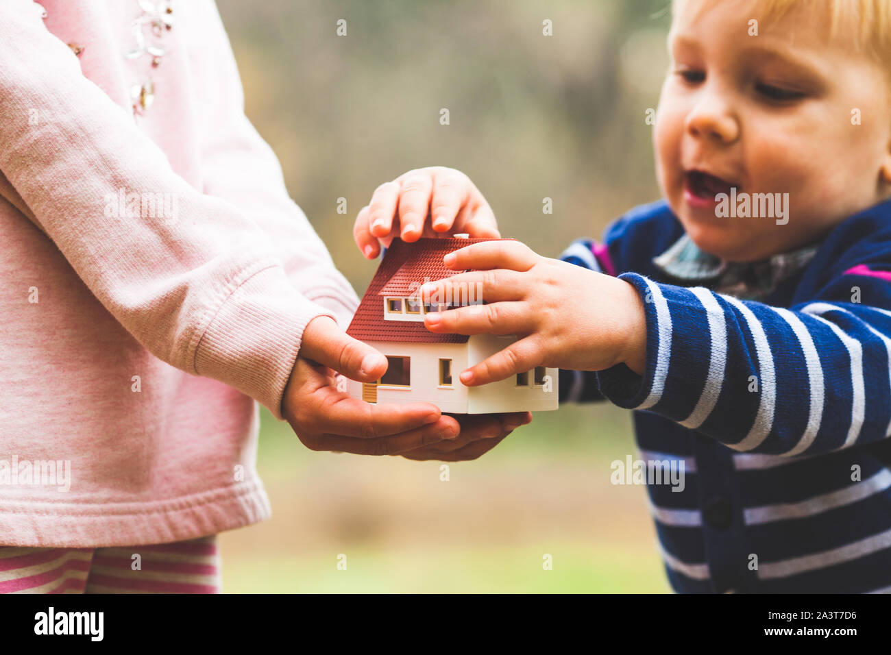 Family for every child, kids with house toy Stock Photo - Alamy