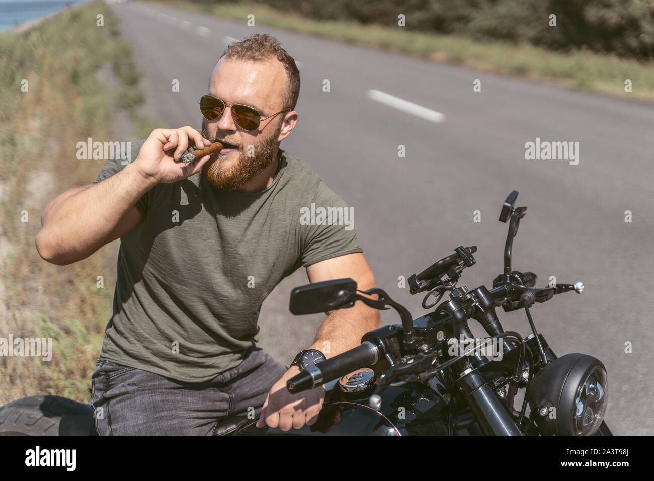 Biker smoking cigar hi-res stock photography and images - Alamy