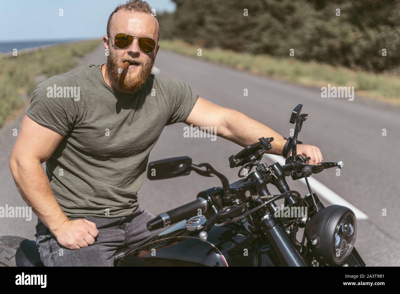Posing with motorcycle hi-res stock photography and images - Alamy