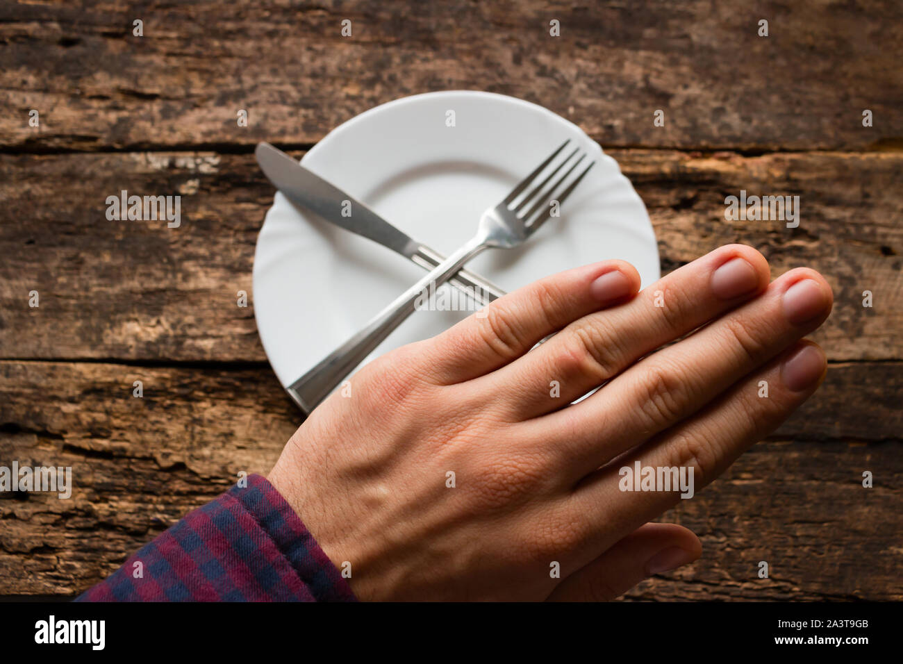 man shows refusal to eat Stock Photo - Alamy