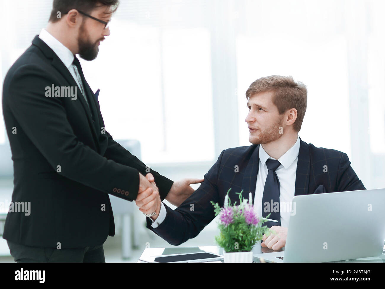 handshake Manager and employee in the workplace Stock Photo - Alamy