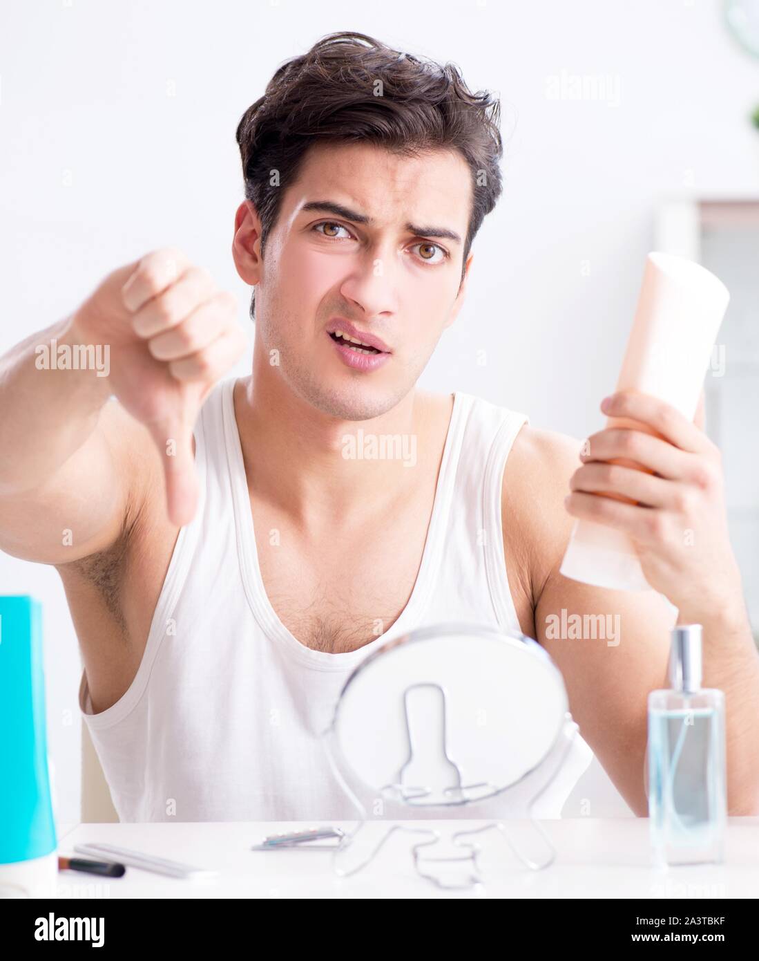 The young handsome man staring in the mirror Stock Photo - Alamy