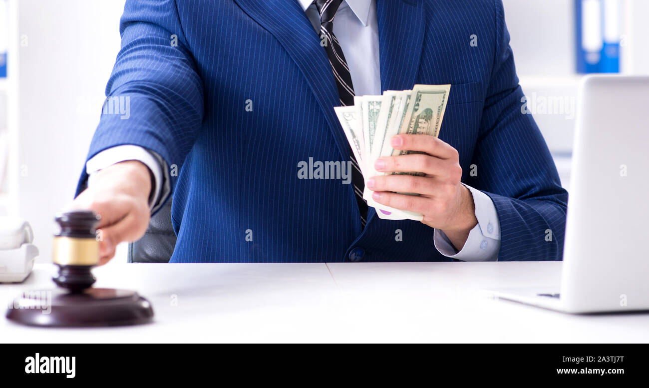 The lawyer receiving money as bribe Stock Photo - Alamy
