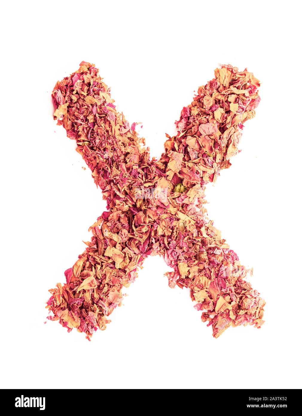 Letter X made of dried rose petals, isolated on white background. Food ...