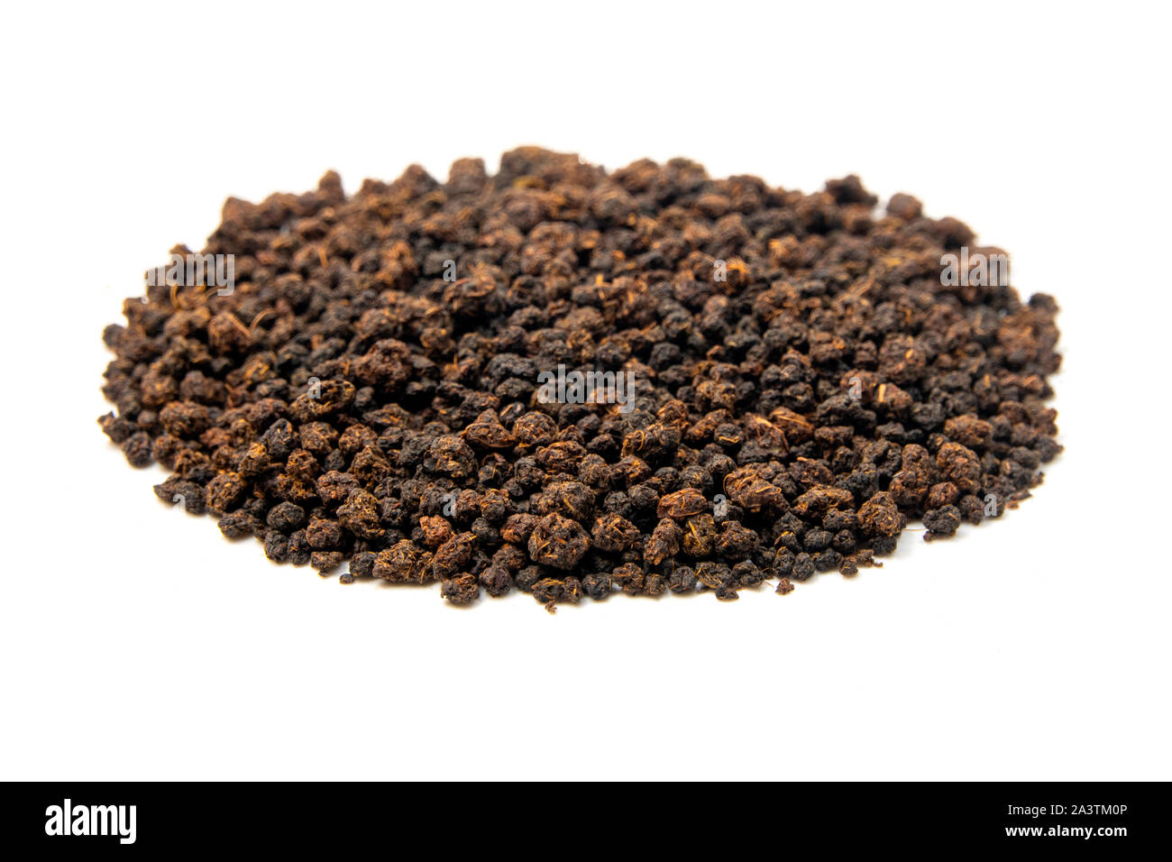 Black granulated tea on a white background Stock Photo - Alamy