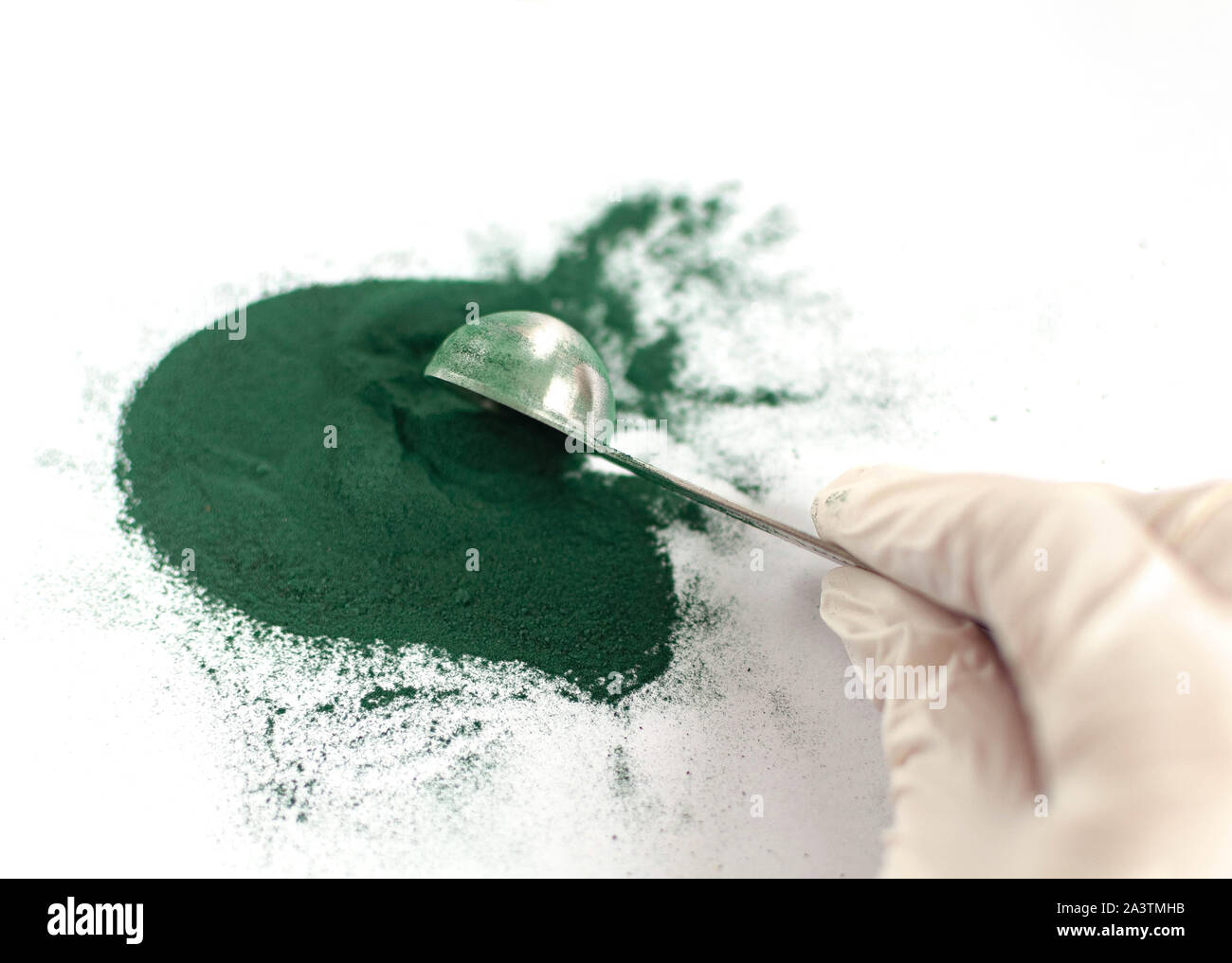 Spirulina or chlorella powder close-up, top view, isolated on white ...