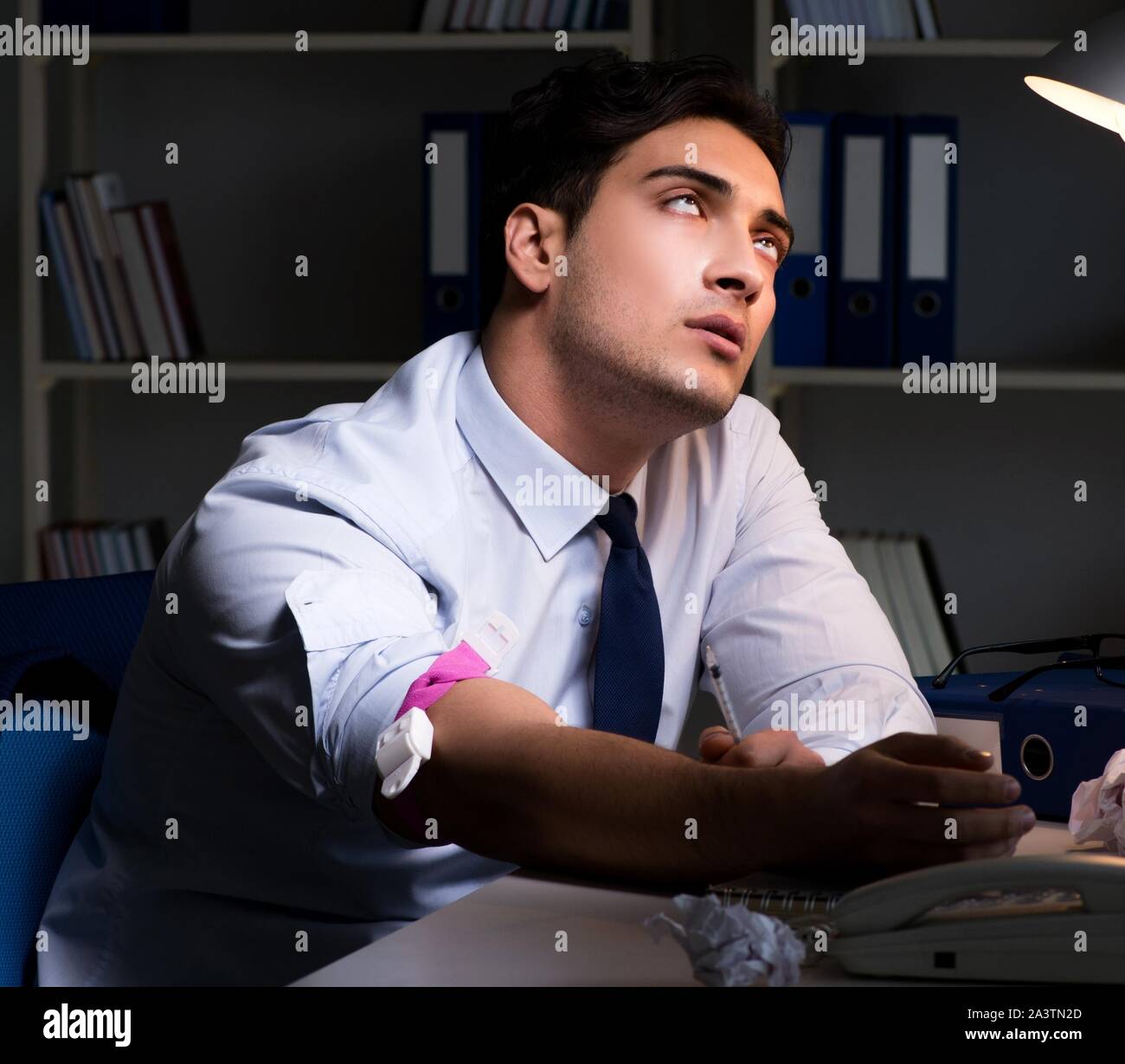 Employee relieving stress from overtime with drugs narcotics Stock ...