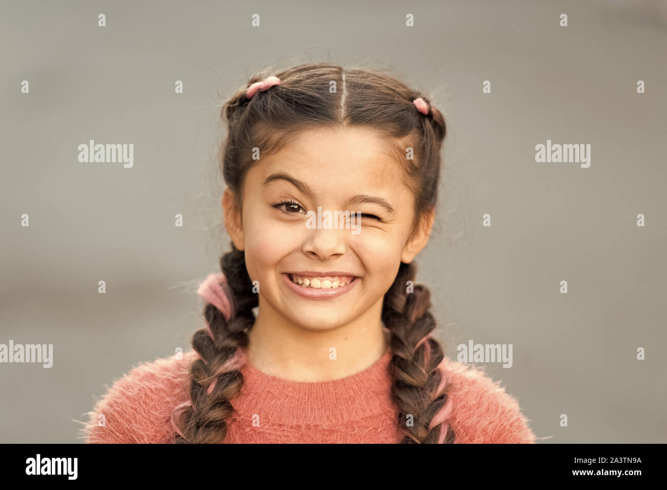Things gonna be alright. Girl wink cheerful face grey background. Kid ...