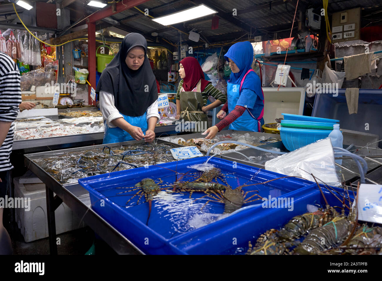 Muslim Thai Women working. Three Muslim female food vendors selling ...